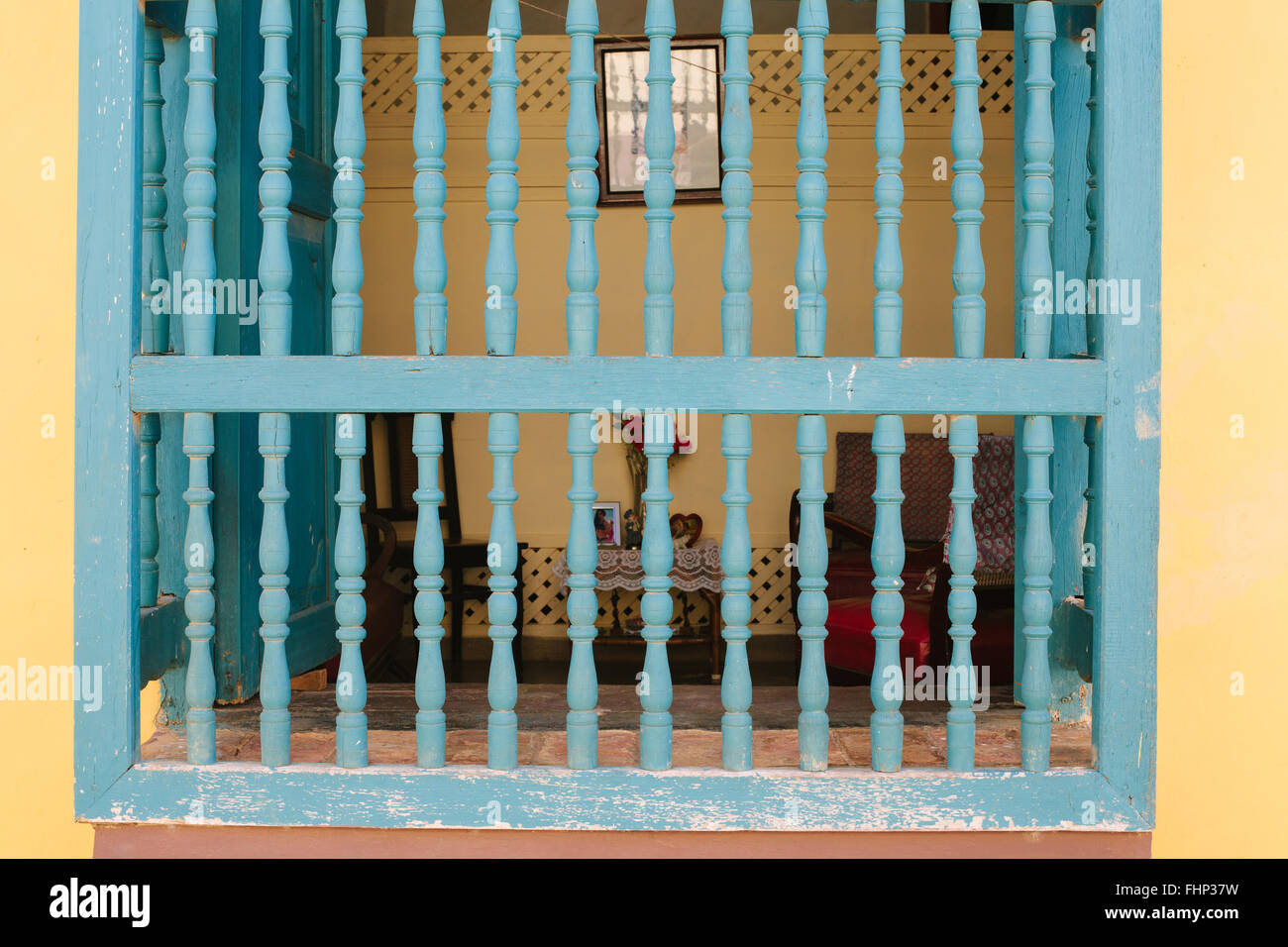The houses of Trinidad have colourful, ornate timber window bars which ...