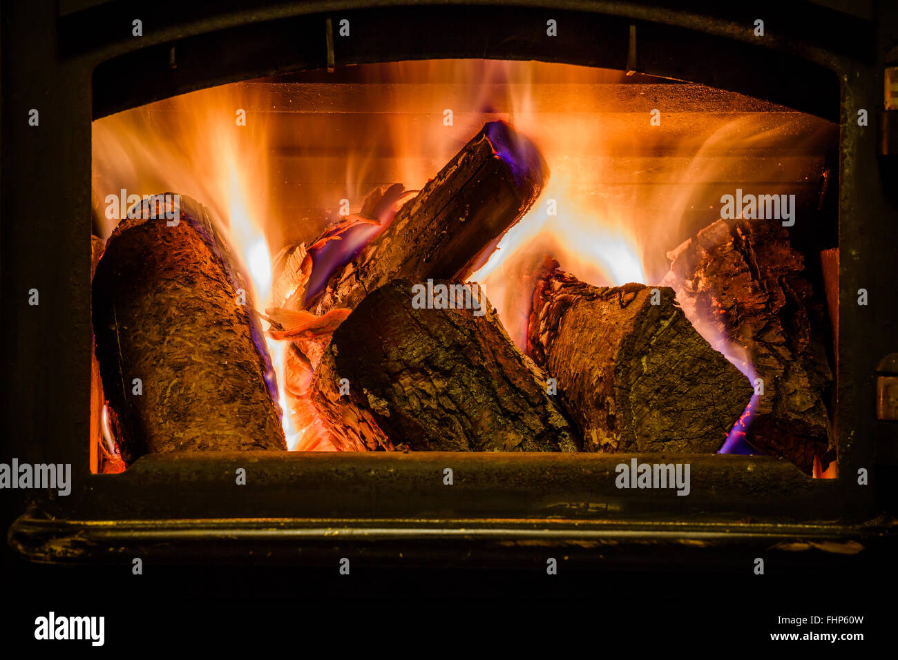 Old fireplace with a burning firewoods Stock Photo - Alamy