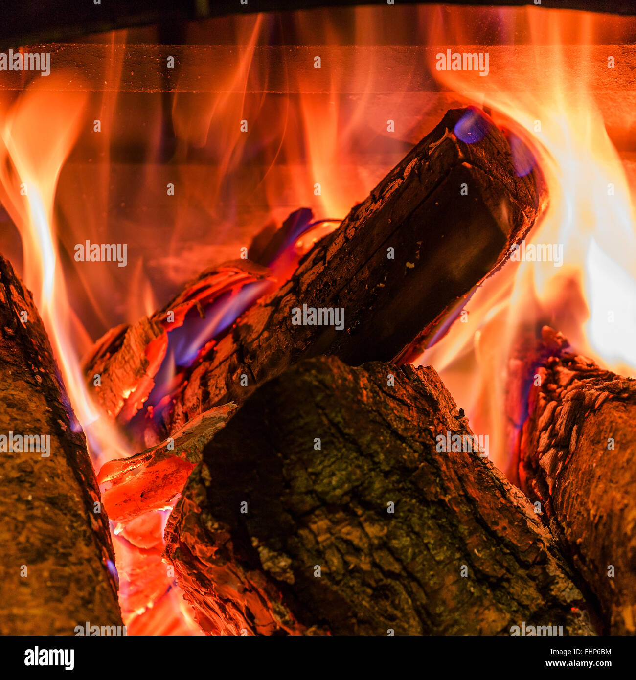 Old fireplace with a burning firewoods Stock Photo - Alamy