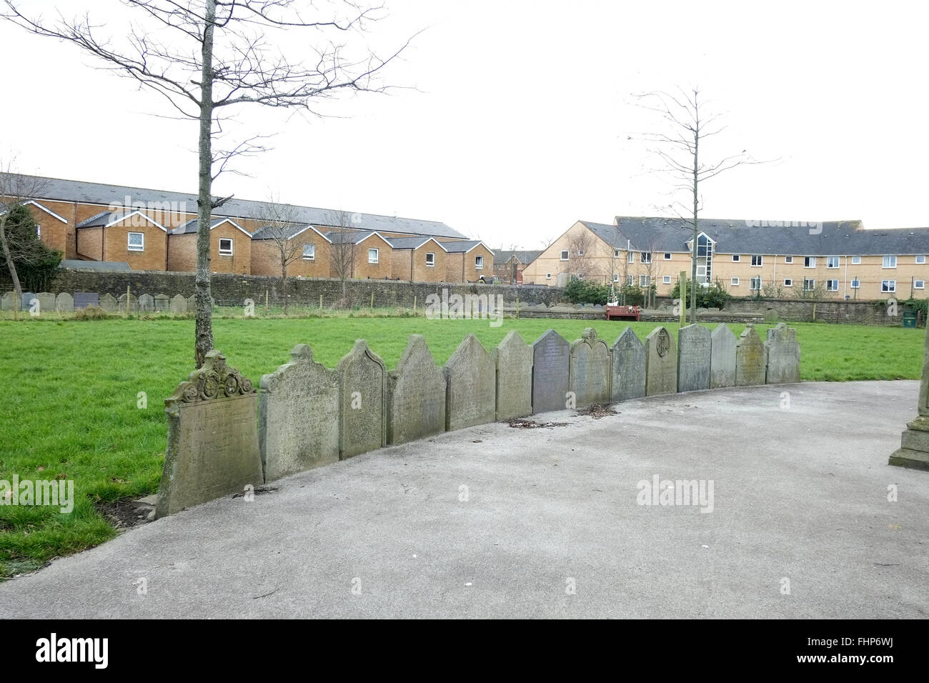Gravestones form a former graveyard being used as path markers in a ...