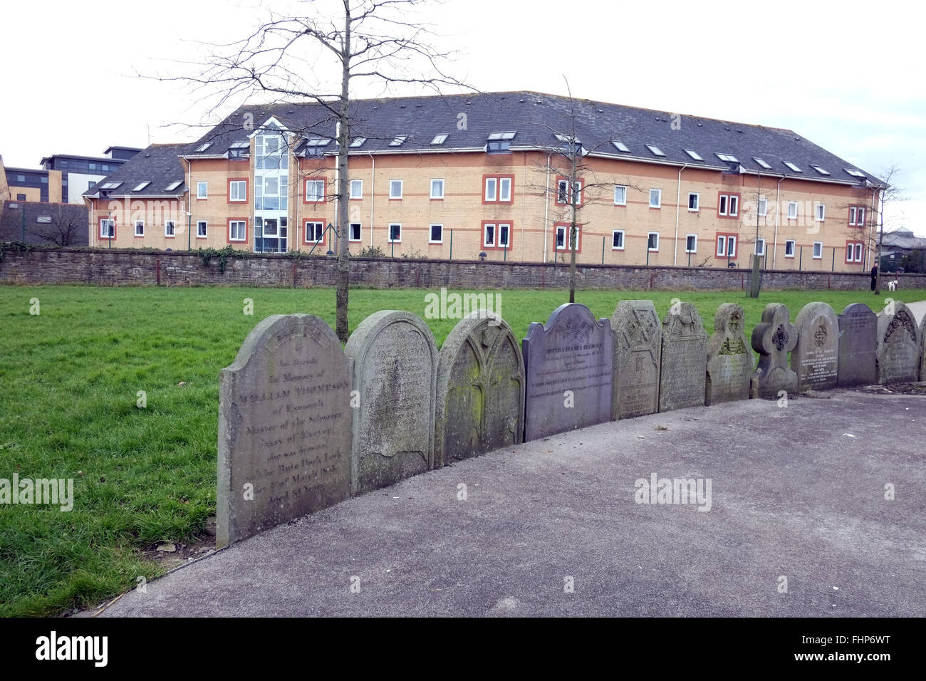 Gravestones form a former graveyard being used as path markers in a ...