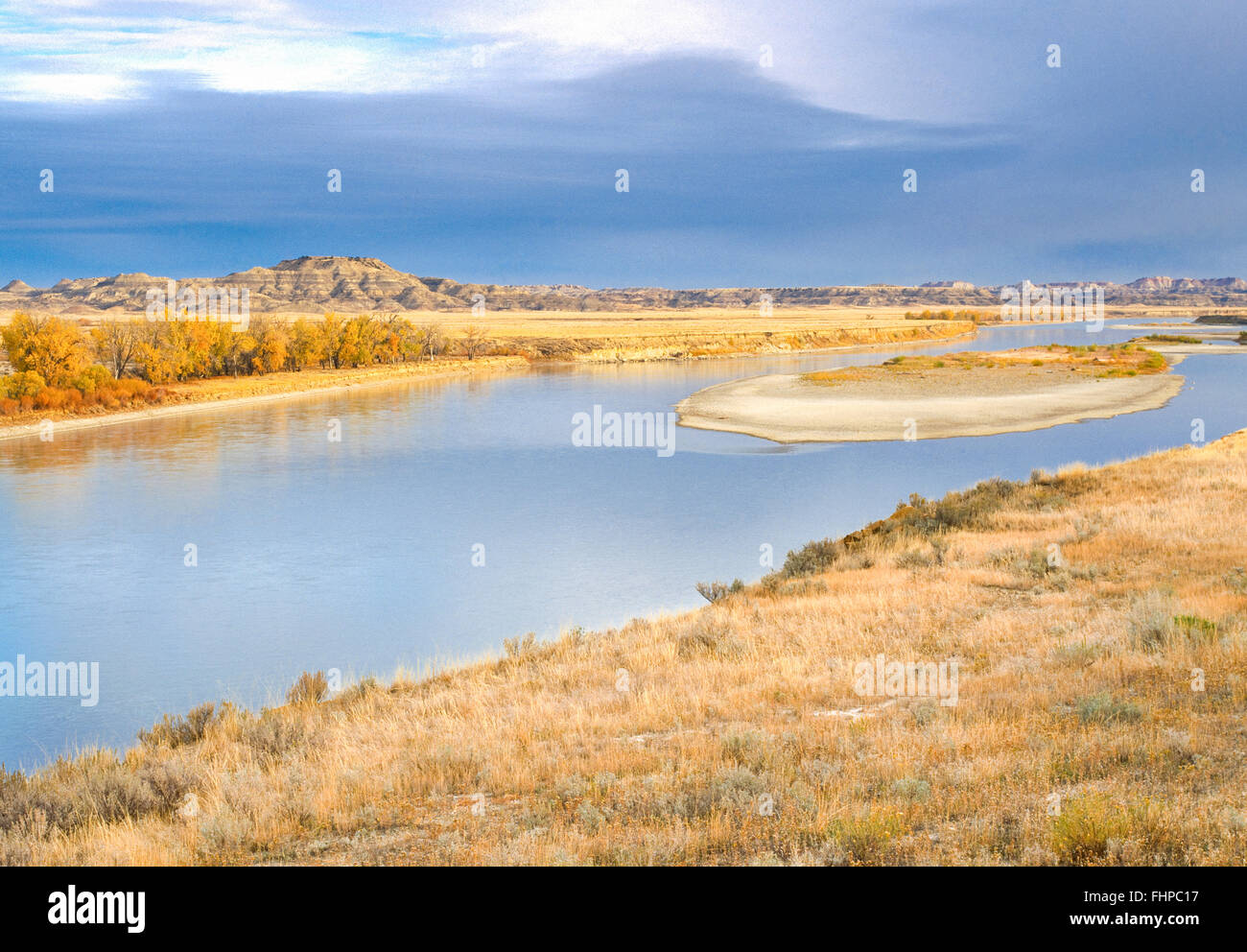 yellowstone river flowing past the terry badlands in autumn near terry ...