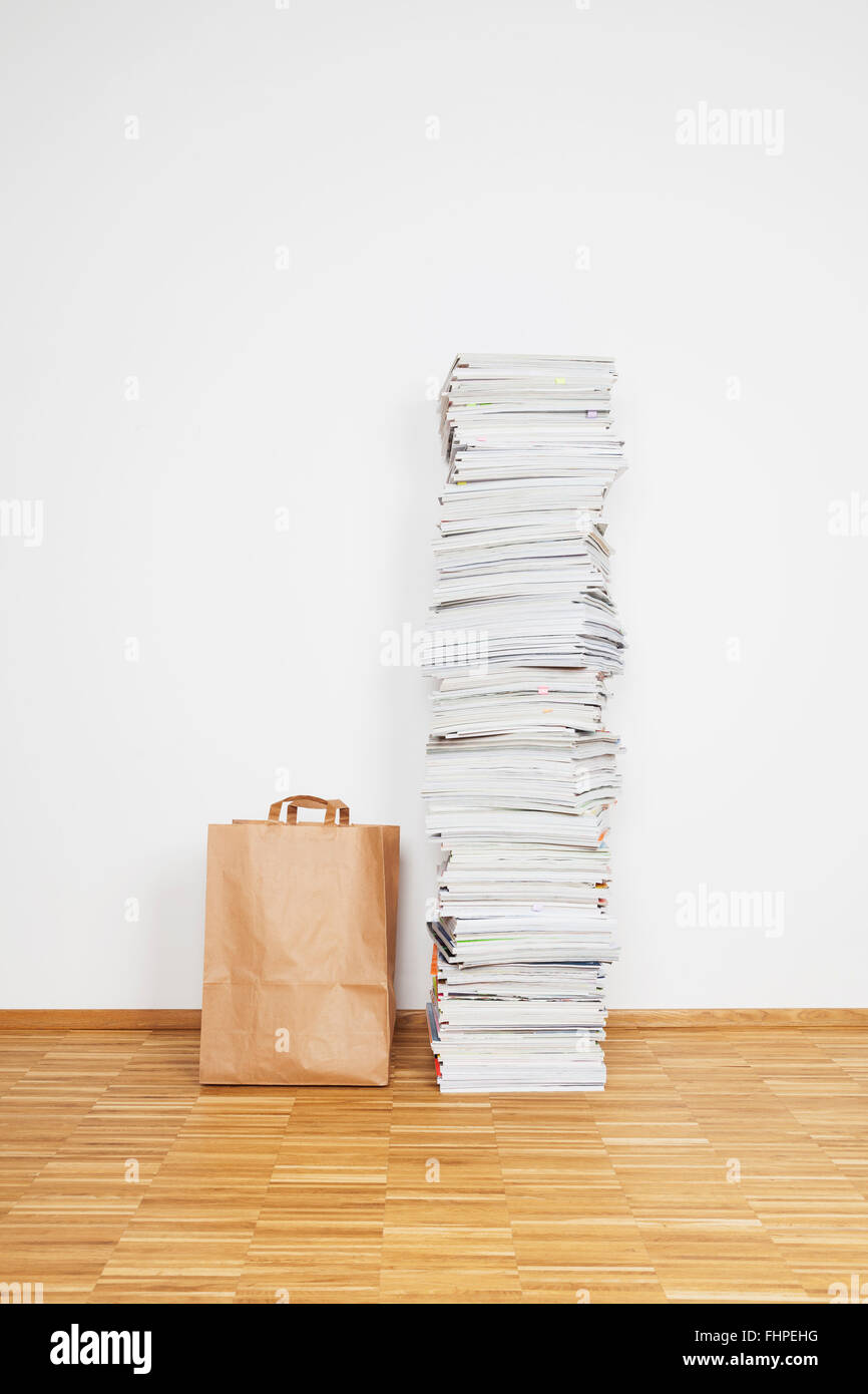Stacked magazines, paper bag, waste paper Stock Photo - Alamy