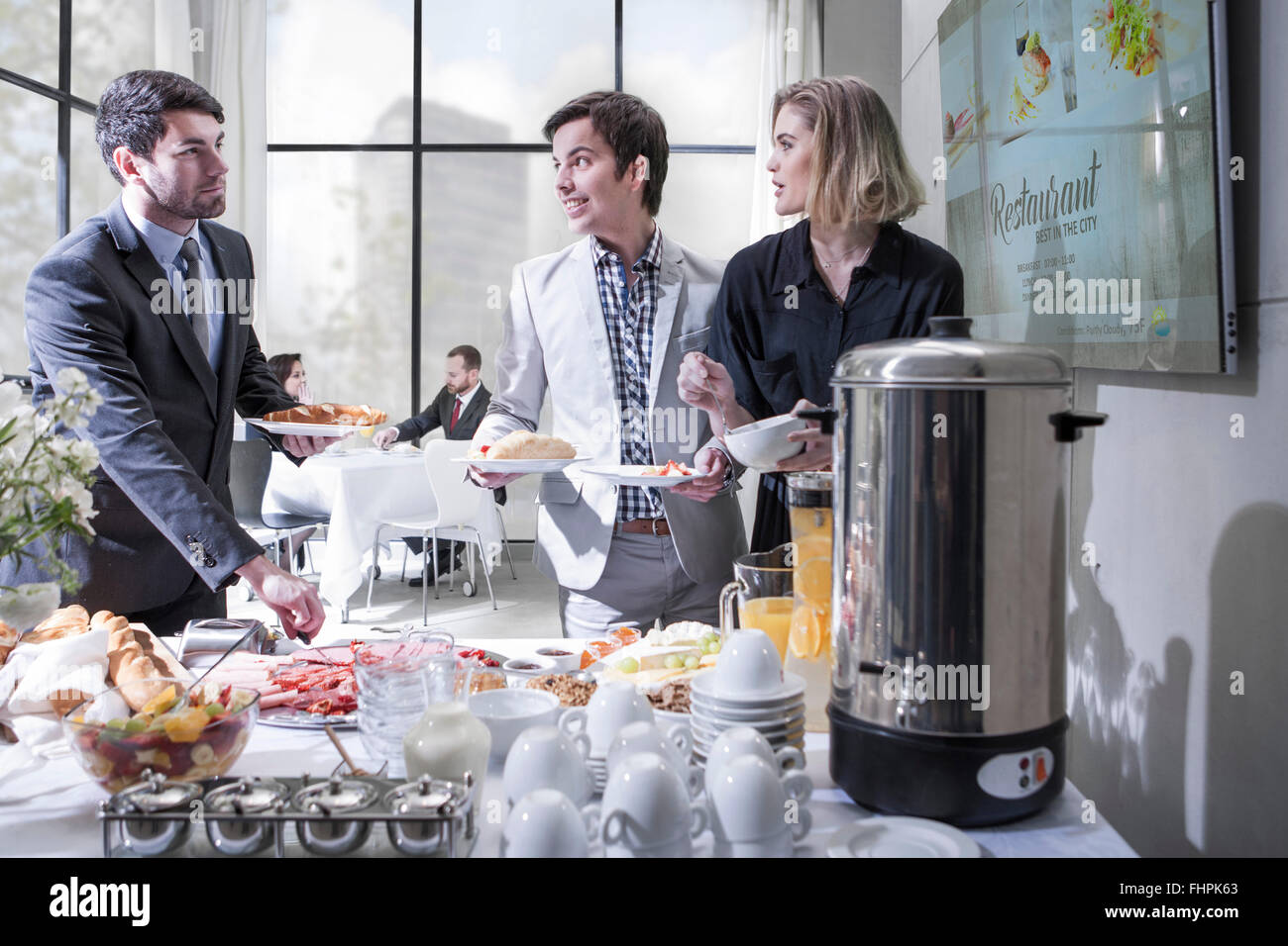 Business people having buffet breakfast at hotel Stock Photo - Alamy