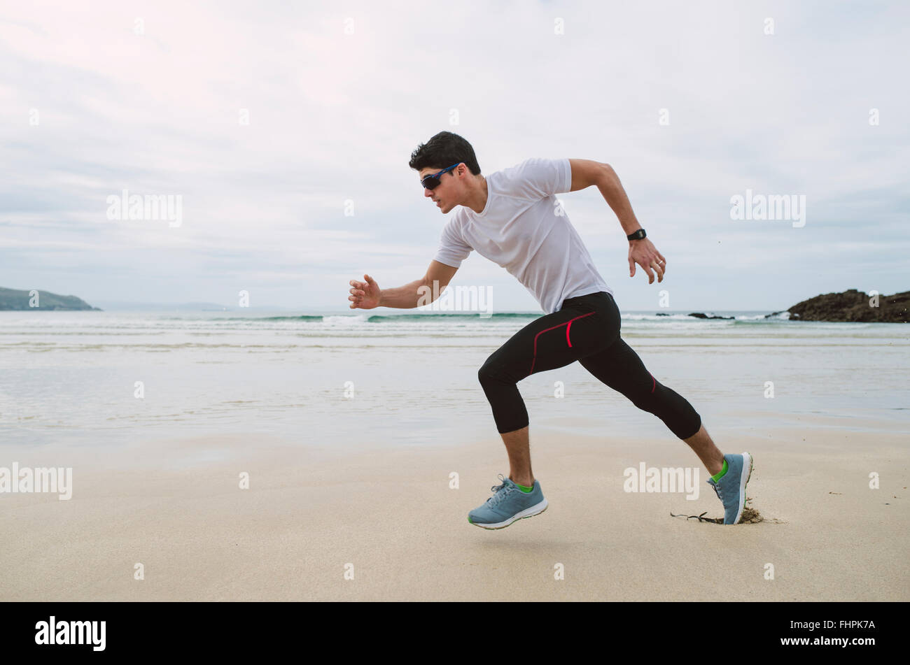 Young athlete training on the beach Stock Photo - Alamy