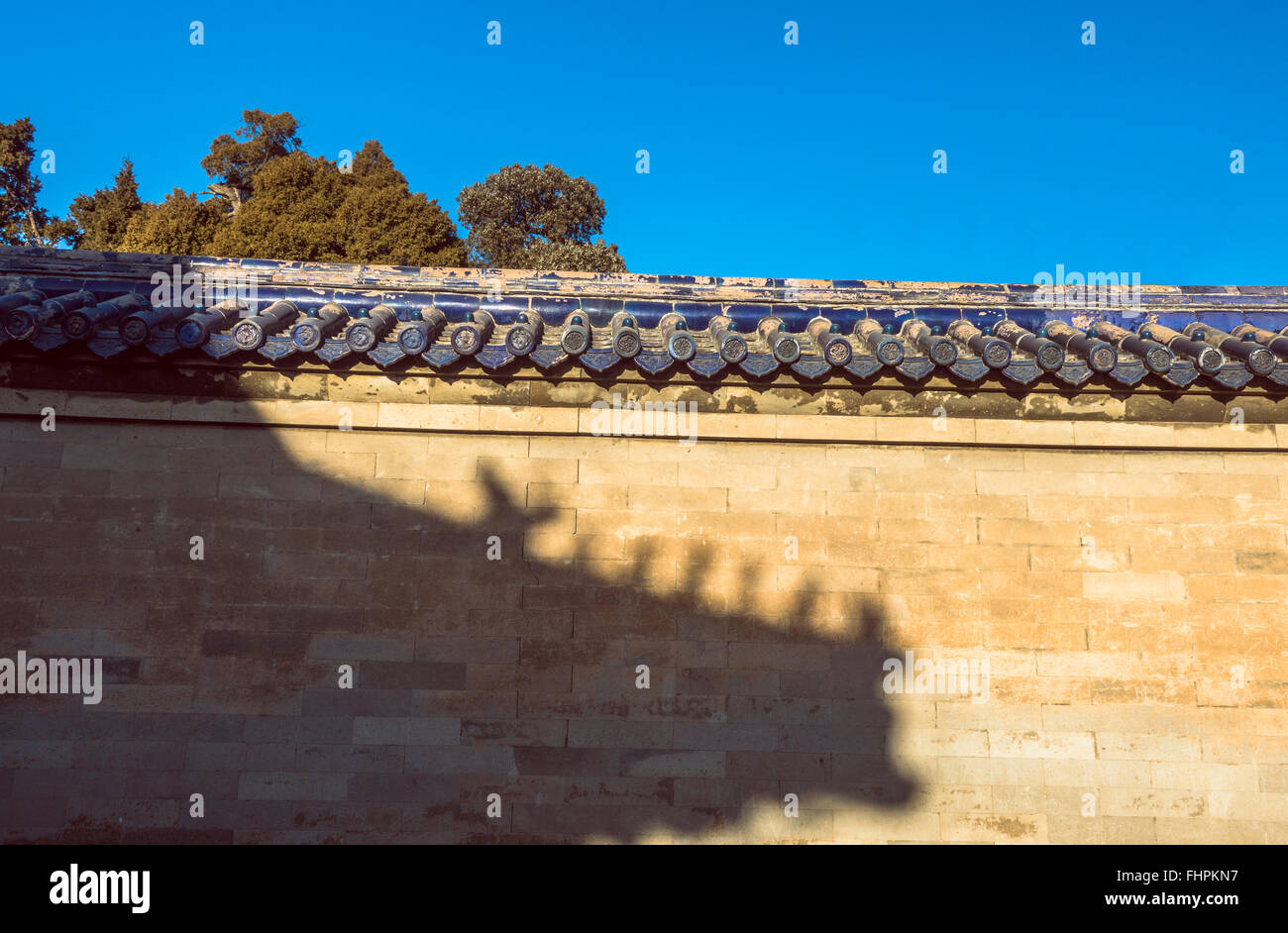 The shadow of the traditional Chinese building on the wall Stock Photo ...