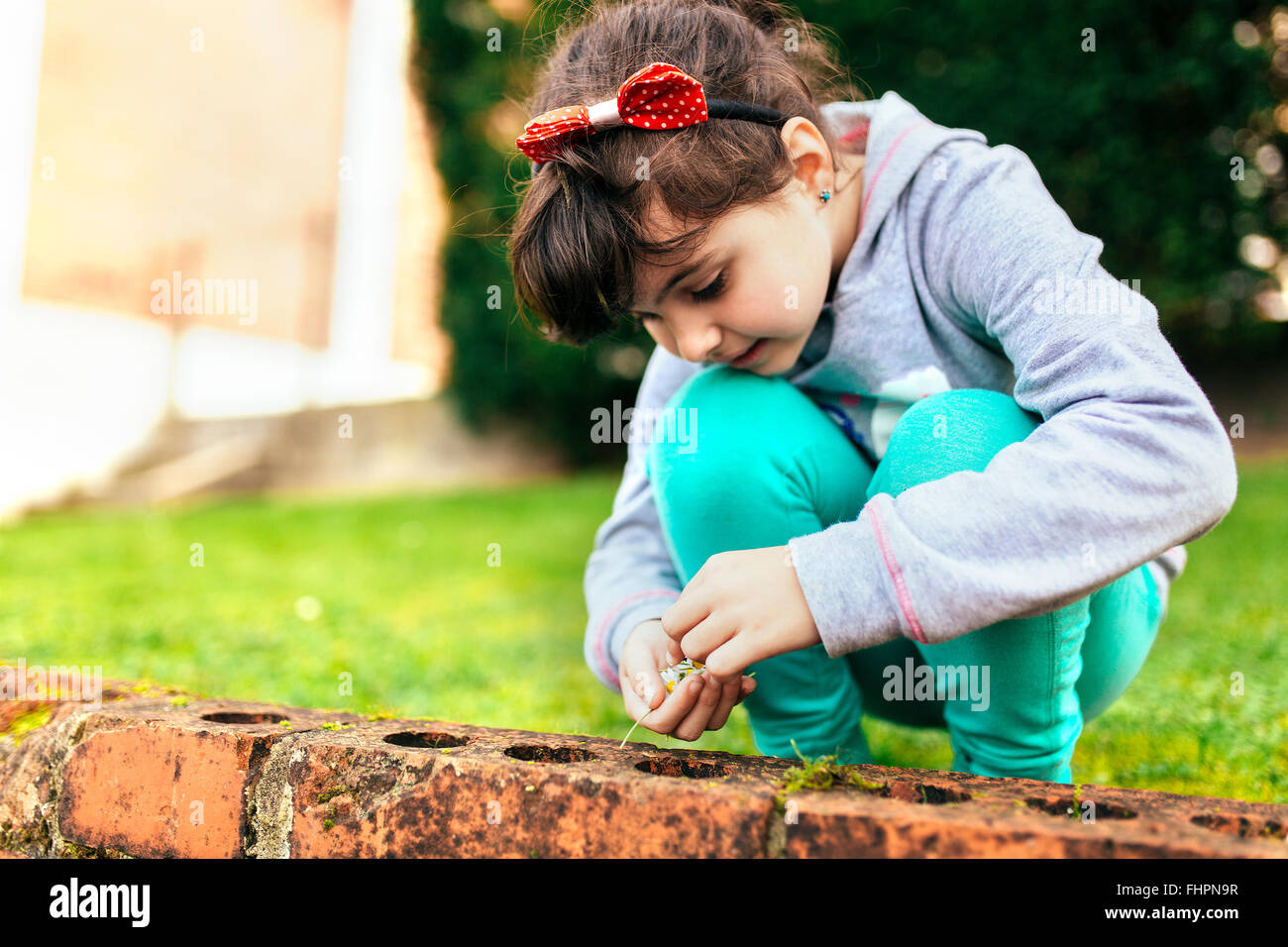 Little Girl Playing Outside Stock Photo Alamy