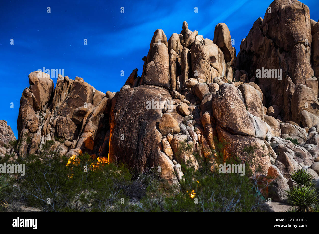 JOSHUA TREE, CA – FEBRUARY 22: Campers fire light on the rocks in ...