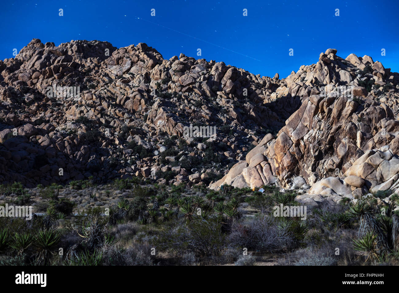 JOSHUA TREE, CA – FEBRUARY 22: Campers fire light on the rocks in ...