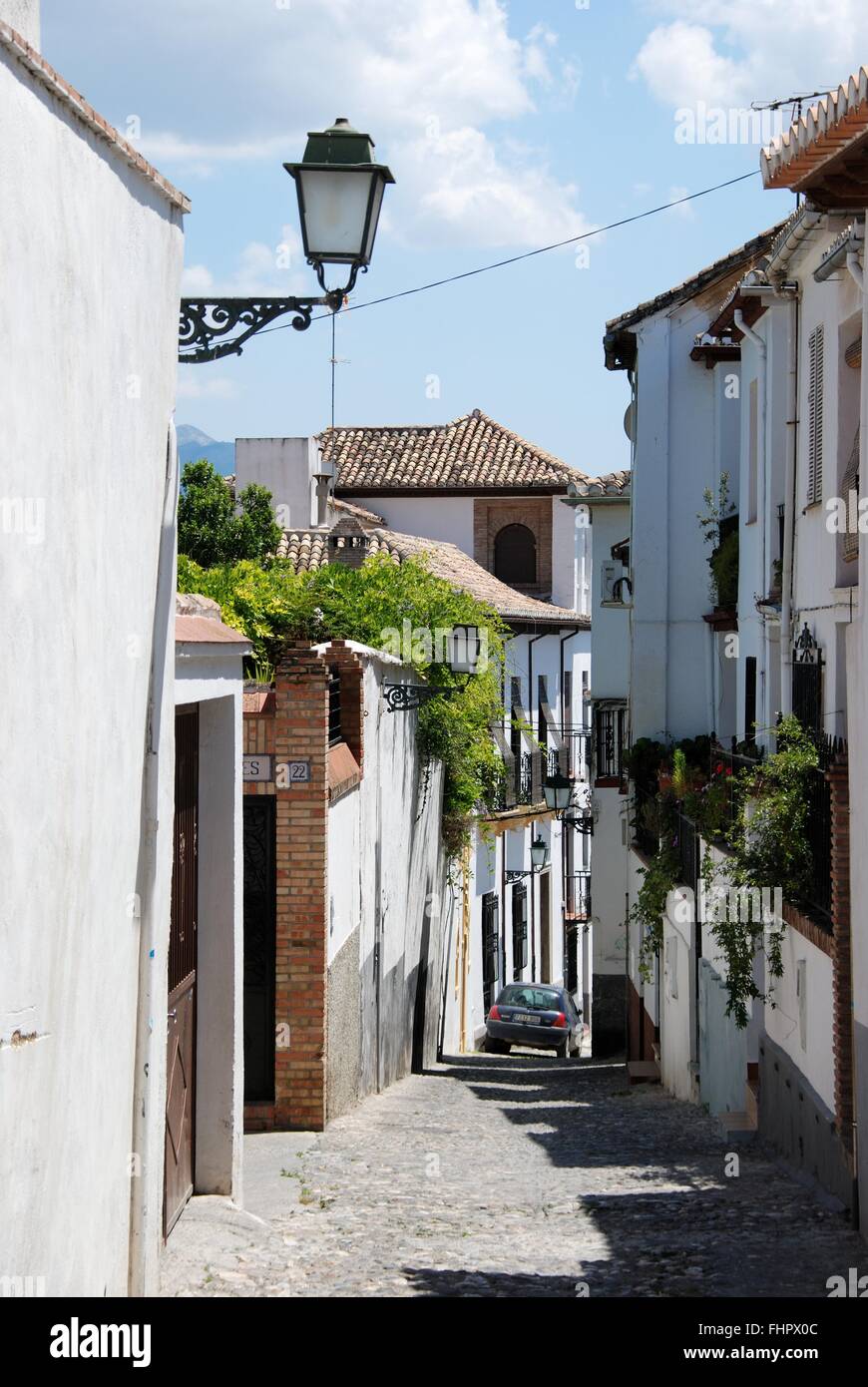 Typical Spanish street with townhouses in the Albaicin District ...