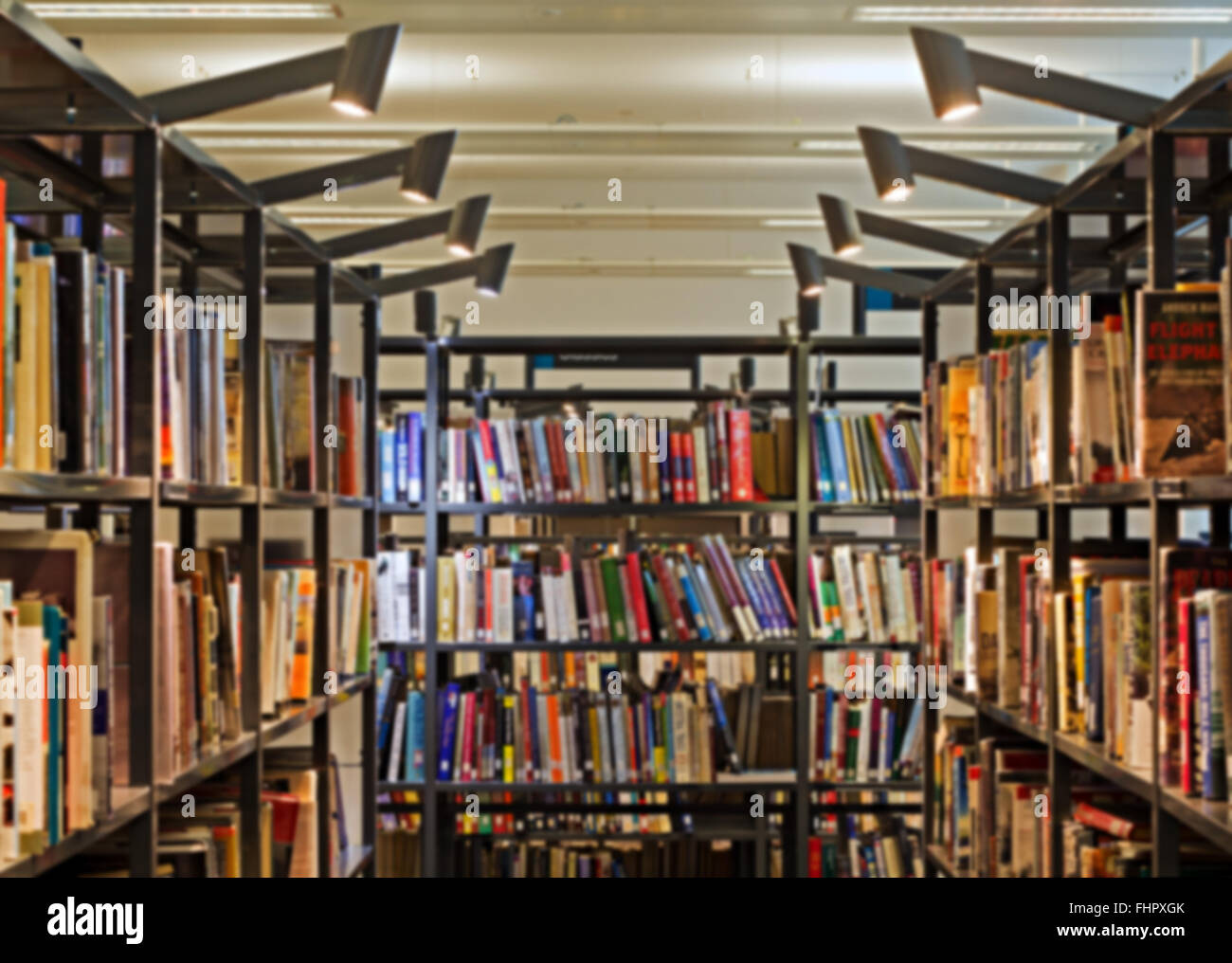 Blurred books in a modern public library Stock Photo - Alamy