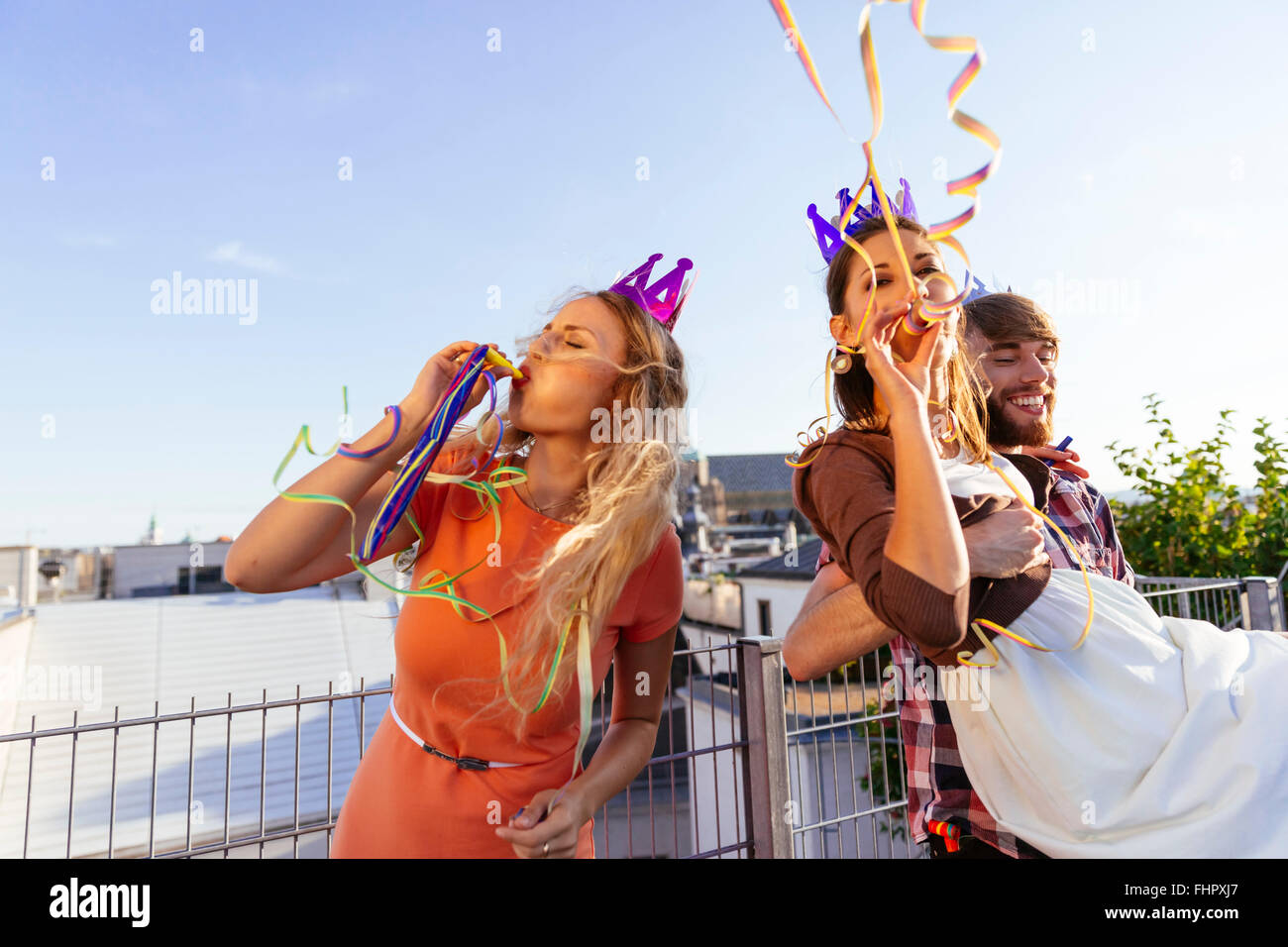 Austria, Vienna, Young people having a party on rooftop terrace Stock ...