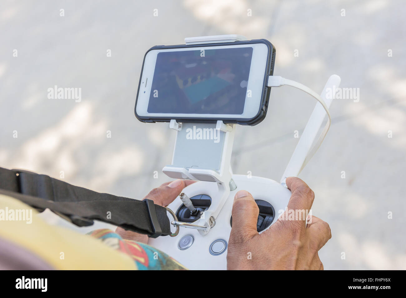 Controlling a remote helicopter drone Stock Photo - Alamy