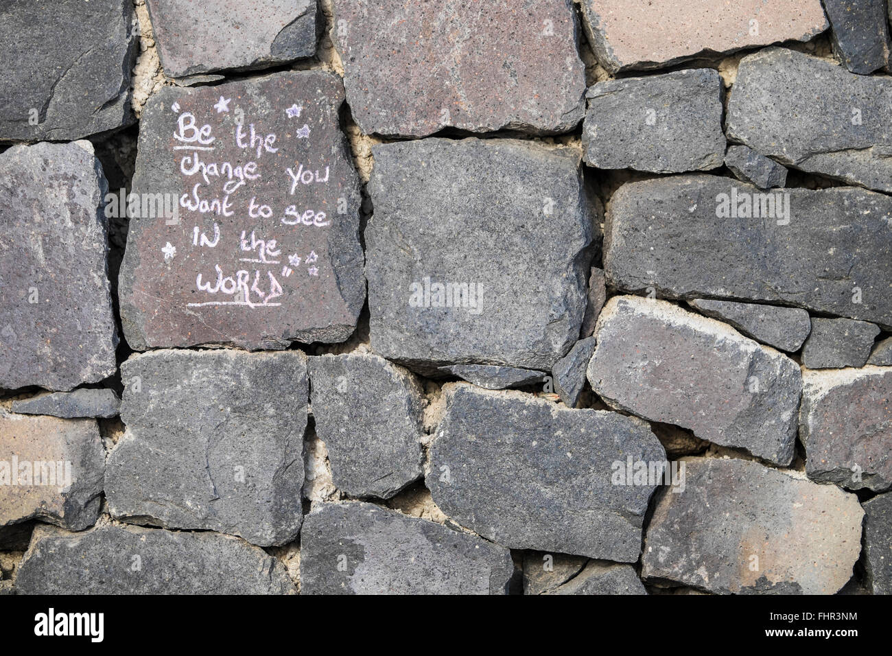 Spain, Tenerife, Saying written on stone wall Stock Photo - Alamy