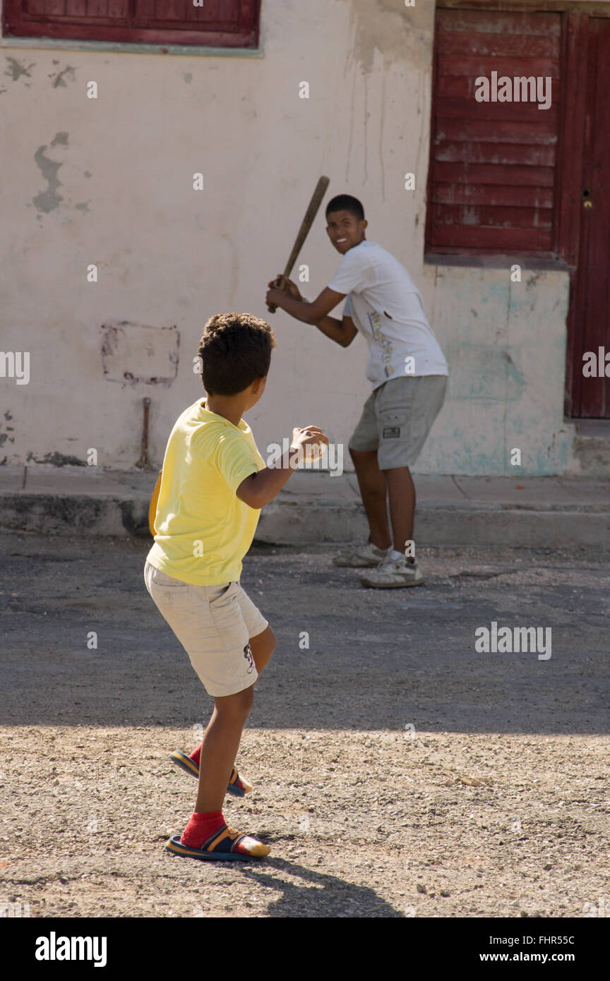 Two young boys playing baseball in the streets of Havana, Cuba Stock ...