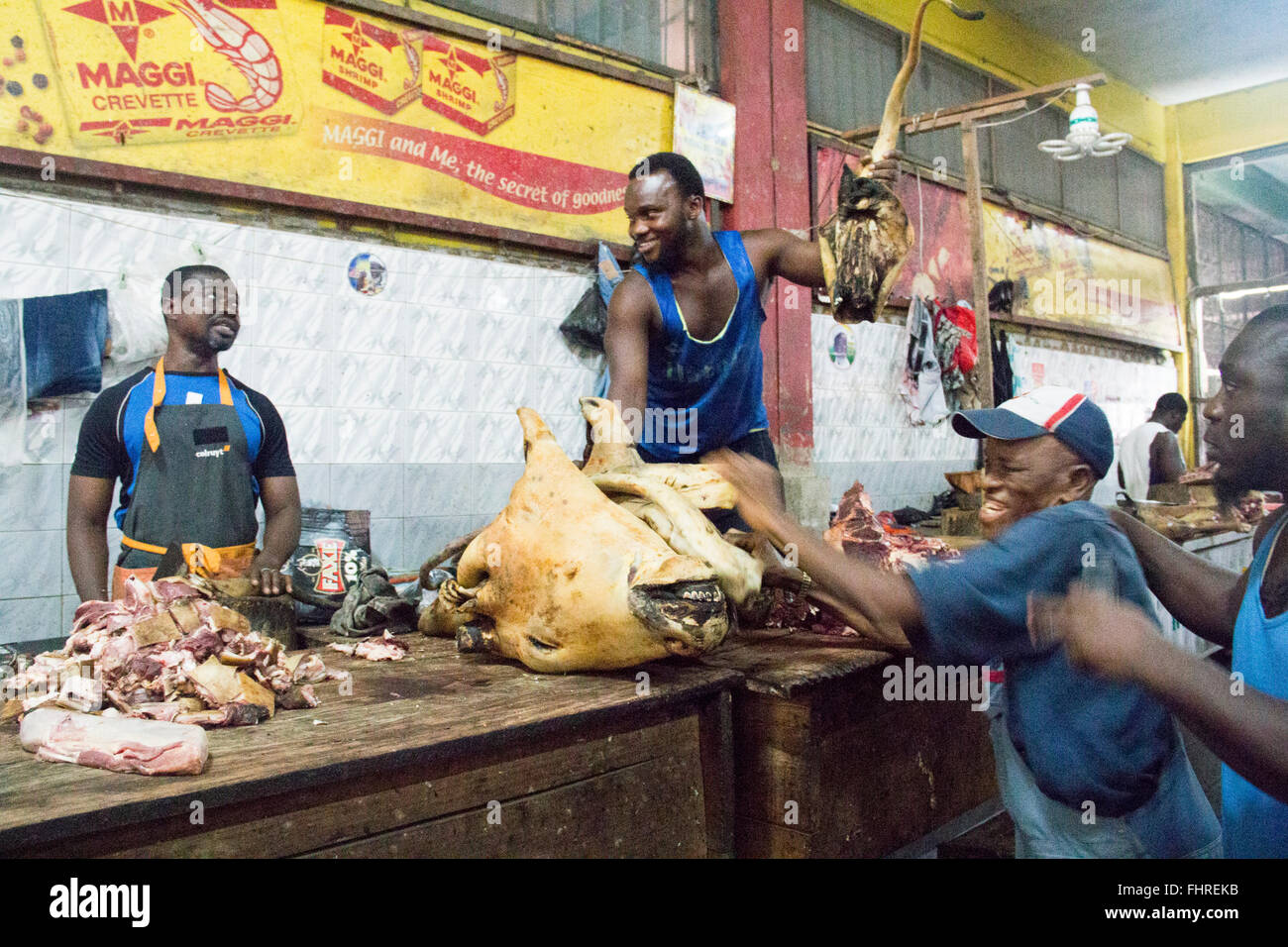 ACCRA, GHANA - JANUARY 2016: Butchers preparing and selling the meat in ...