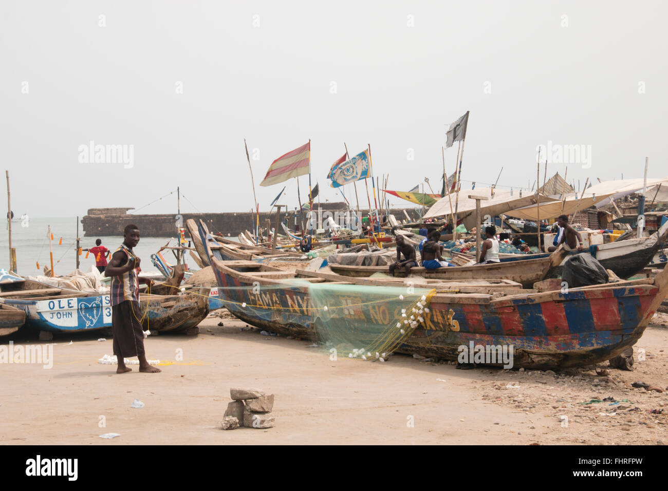 ACCRA, GHANA - JANUARY 2016: A fisherman preparing the net on his ...