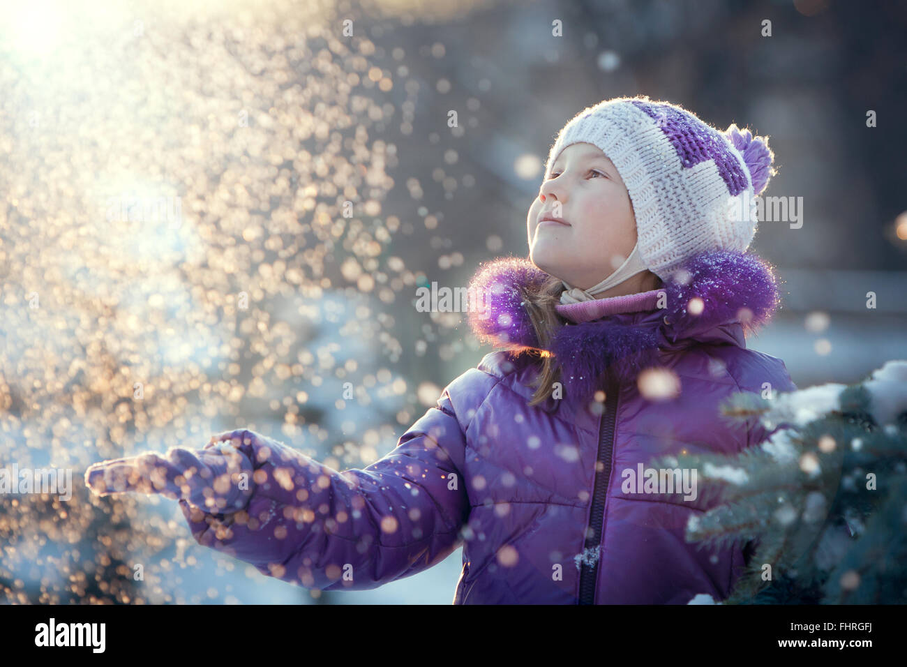 The child catches the snow hands Stock Photo - Alamy