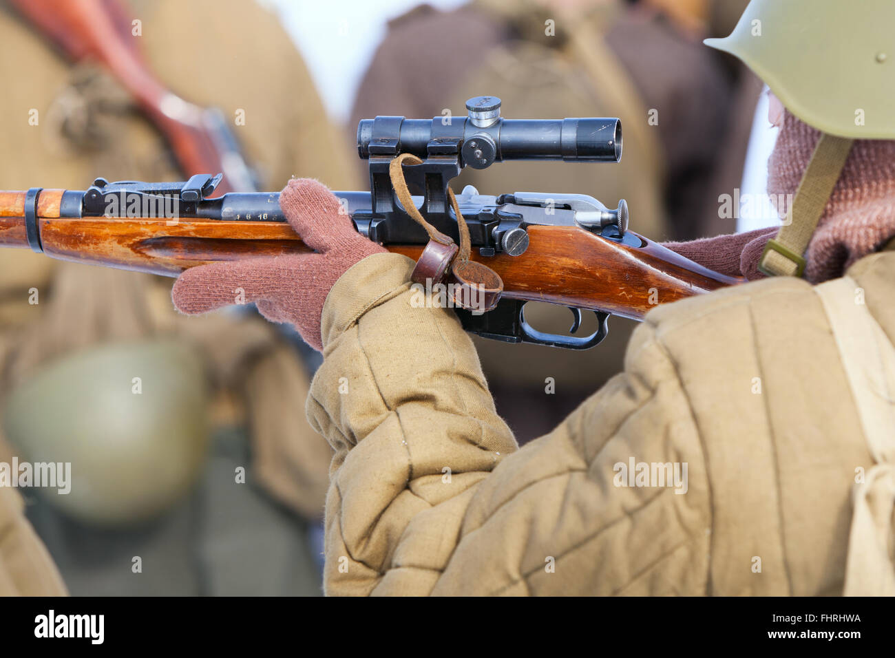 soldier or sniper hands holding gun Stock Photo - Alamy