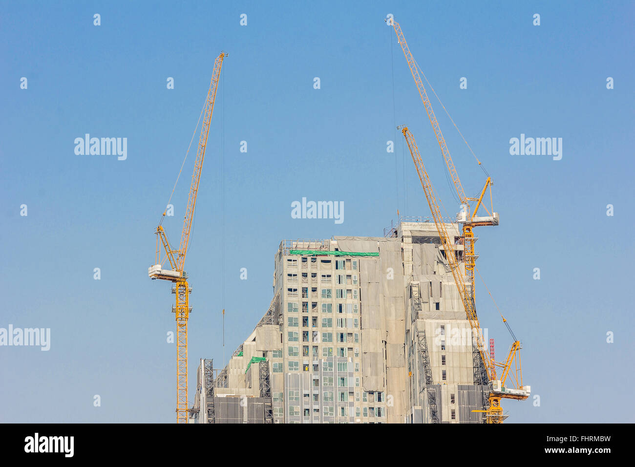 Inside place for many tall buildings under construction and cranes ...