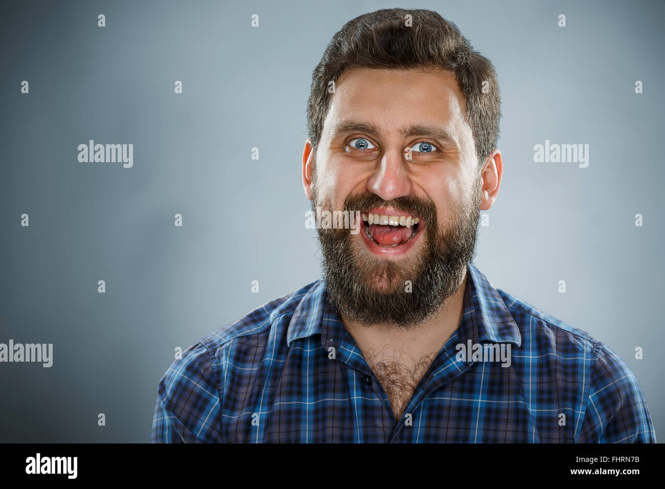 Closeup headshot portrait, happy ecstasy handsome man in blue shirt on ...