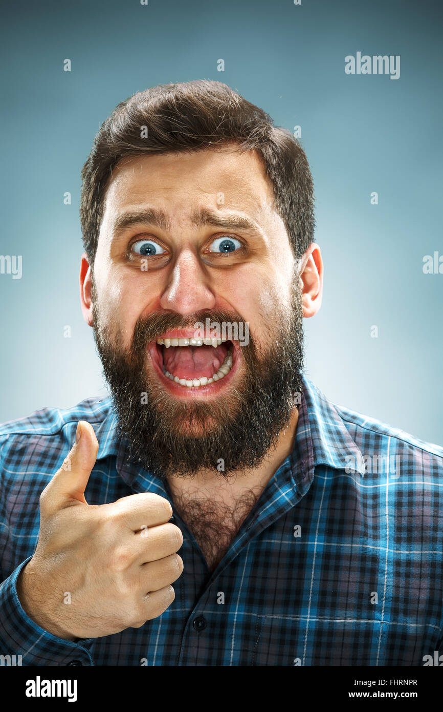 Closeup headshot portrait, happy ecstasy handsome man in blue shirt on ...
