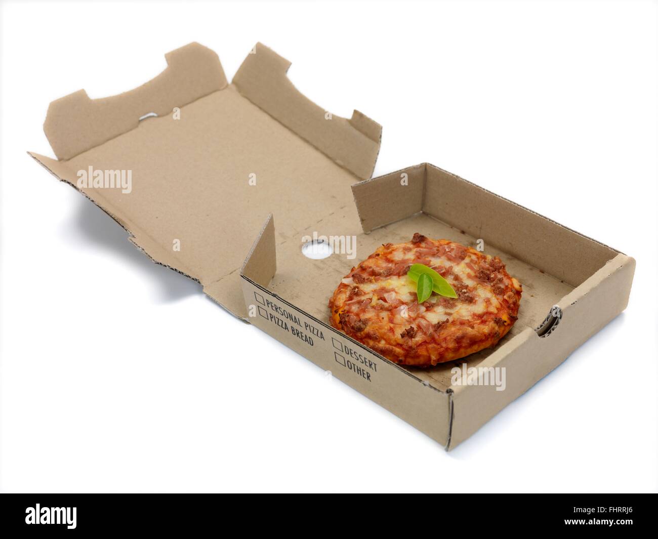 Mini Pizzas isolated on a kitchen bench Stock Photo - Alamy