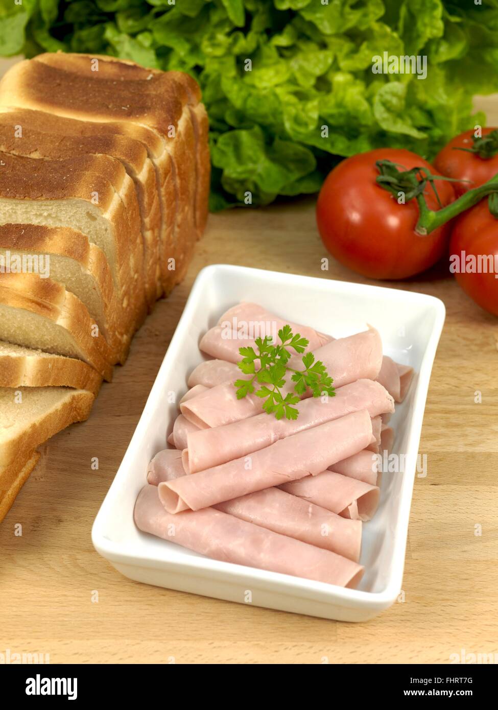 Sliced sandwich ham on a kitchen bench Stock Photo - Alamy