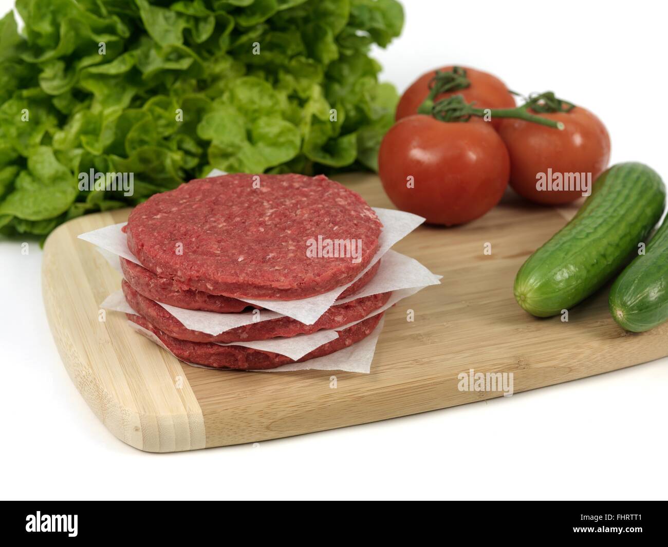 raw hamburger patties on a kitchen bench Stock Photo - Alamy