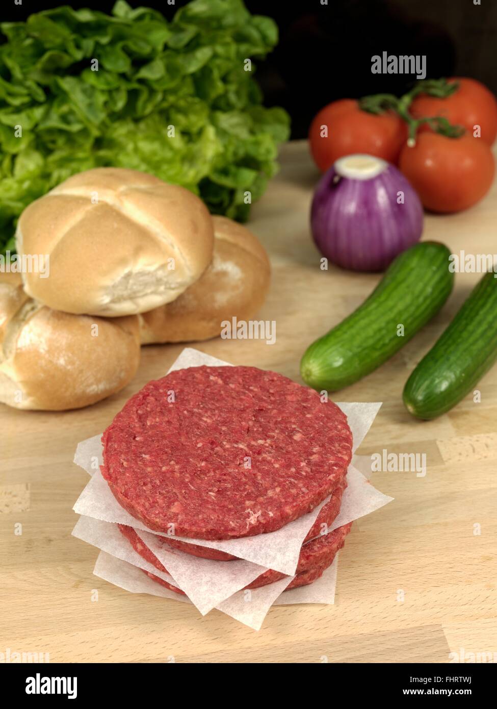 raw hamburger patties on a kitchen bench Stock Photo - Alamy