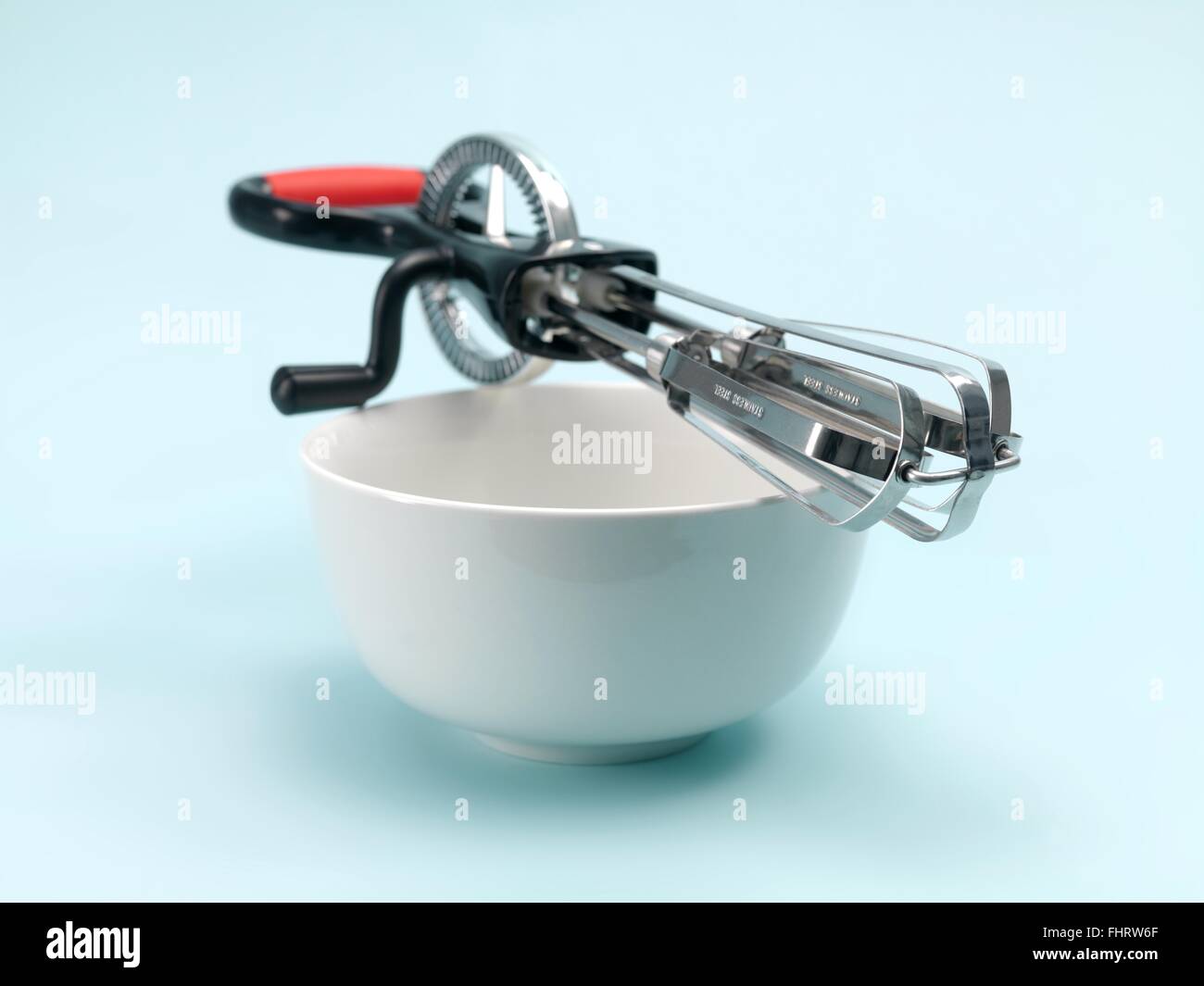 An egg beater on a kitchen bench Stock Photo - Alamy