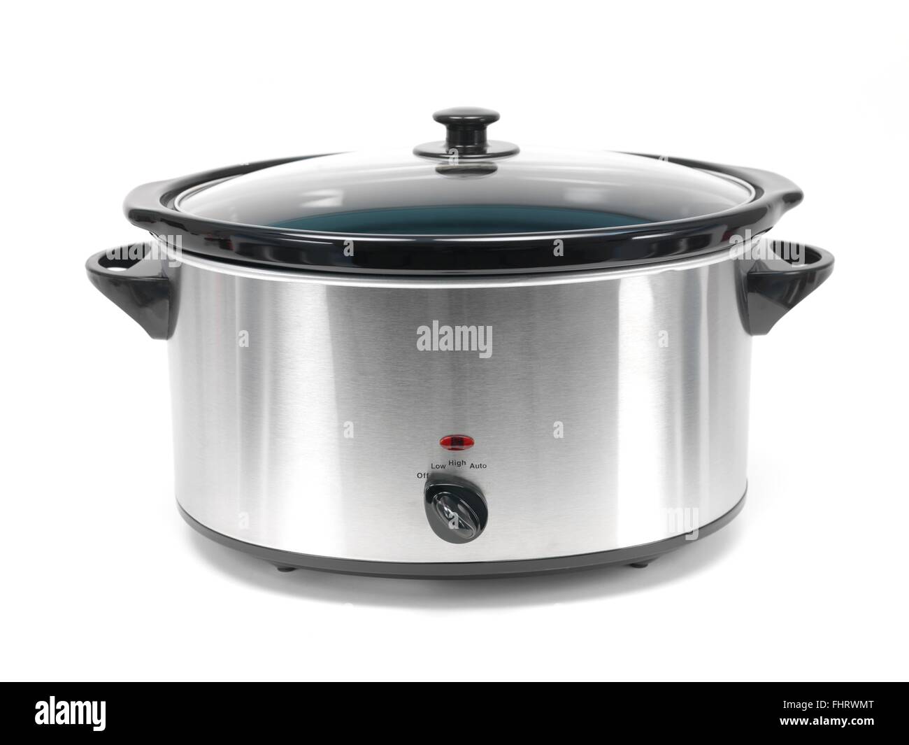An electric slow cooker on a kitchen bench Stock Photo - Alamy