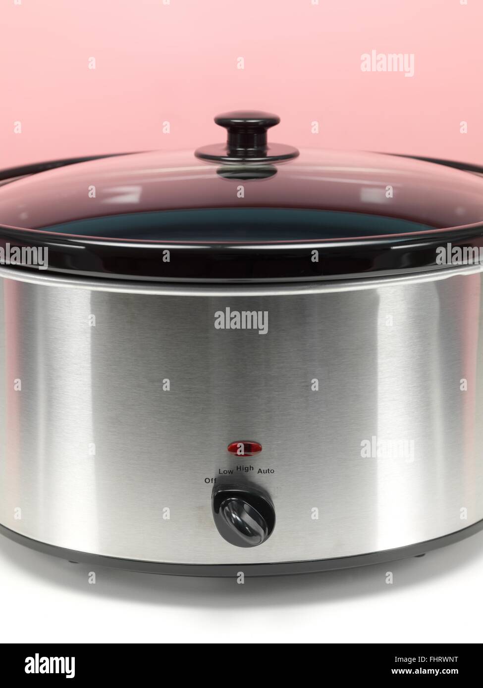 An electric slow cooker on a kitchen bench Stock Photo - Alamy