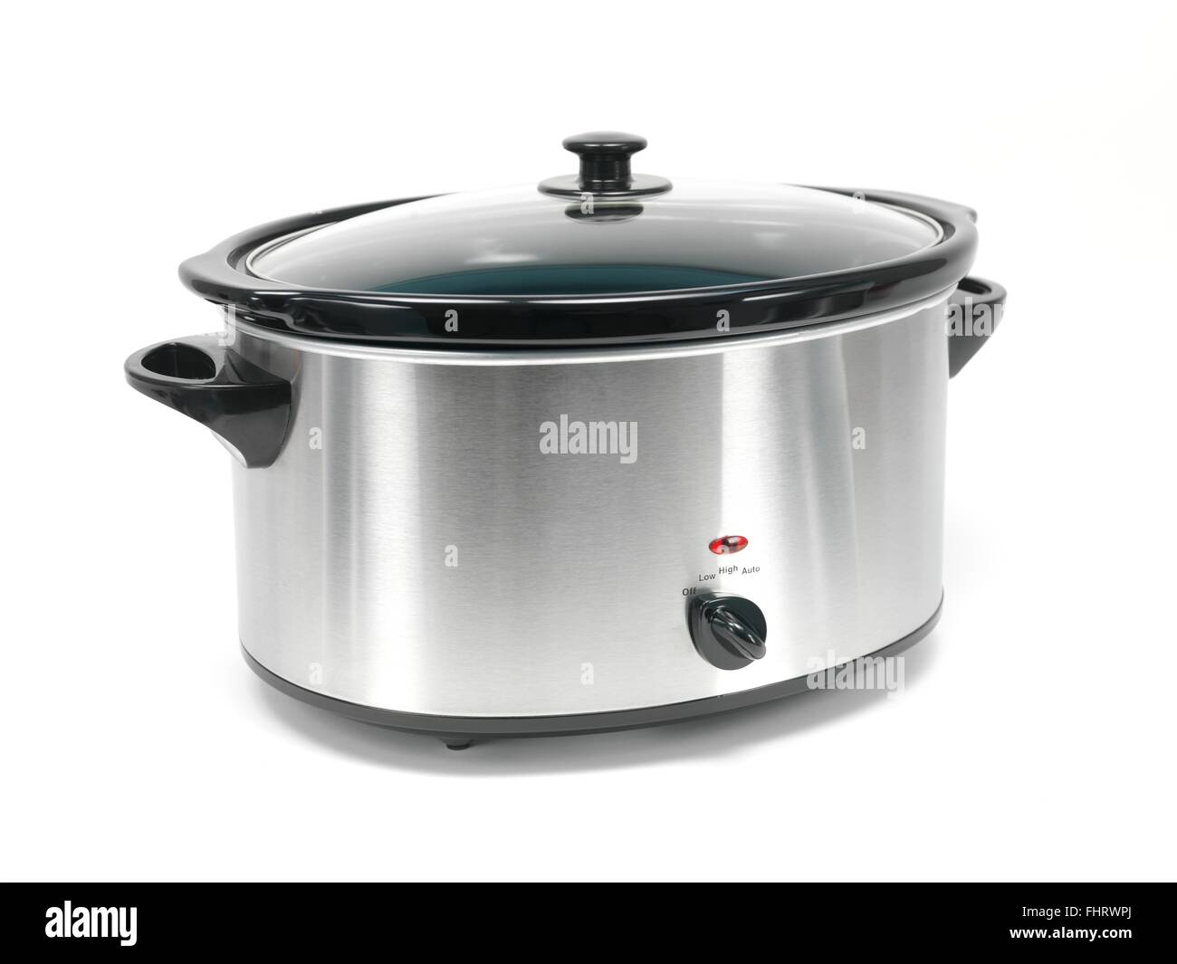 An electric slow cooker on a kitchen bench Stock Photo - Alamy