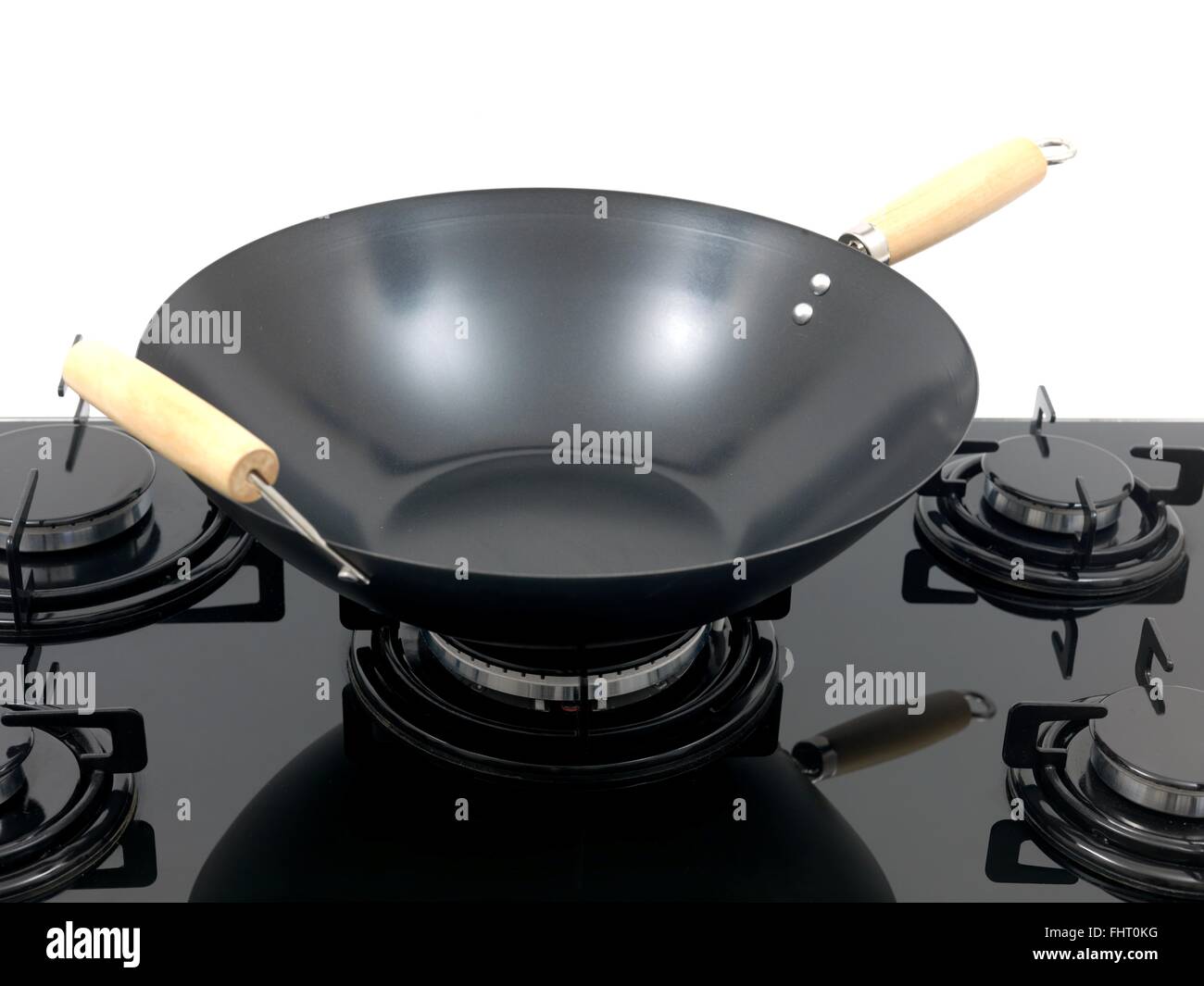 A wok on a kitchen cook top Stock Photo - Alamy