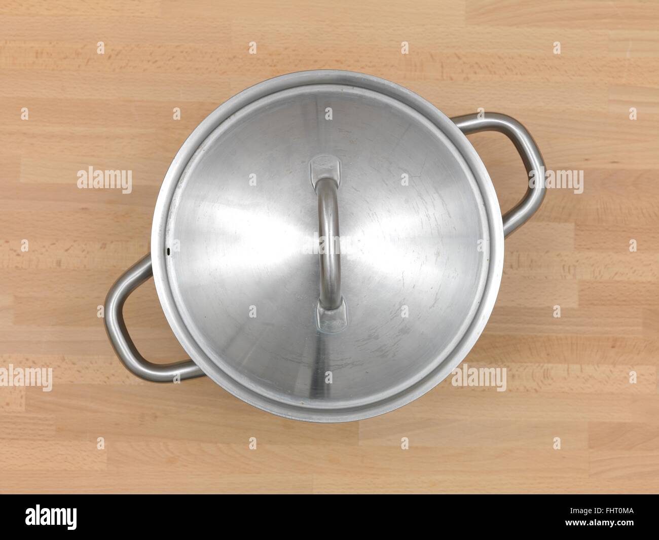 Pots and pans on a wooden kitchen bench Stock Photo - Alamy