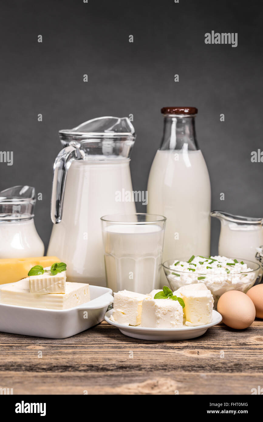 Dairy products on old wooden table Stock Photo - Alamy