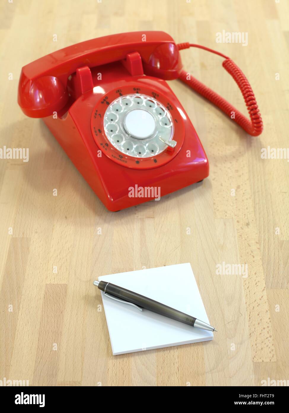 A vintage rotary telephone on a desk Stock Photo - Alamy