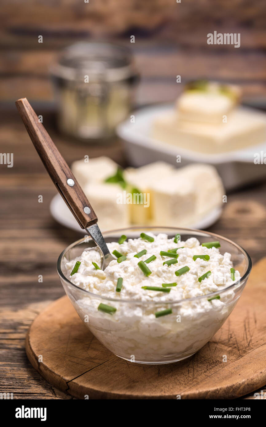 Cottage cheese with chives in glass bowl Stock Photo - Alamy