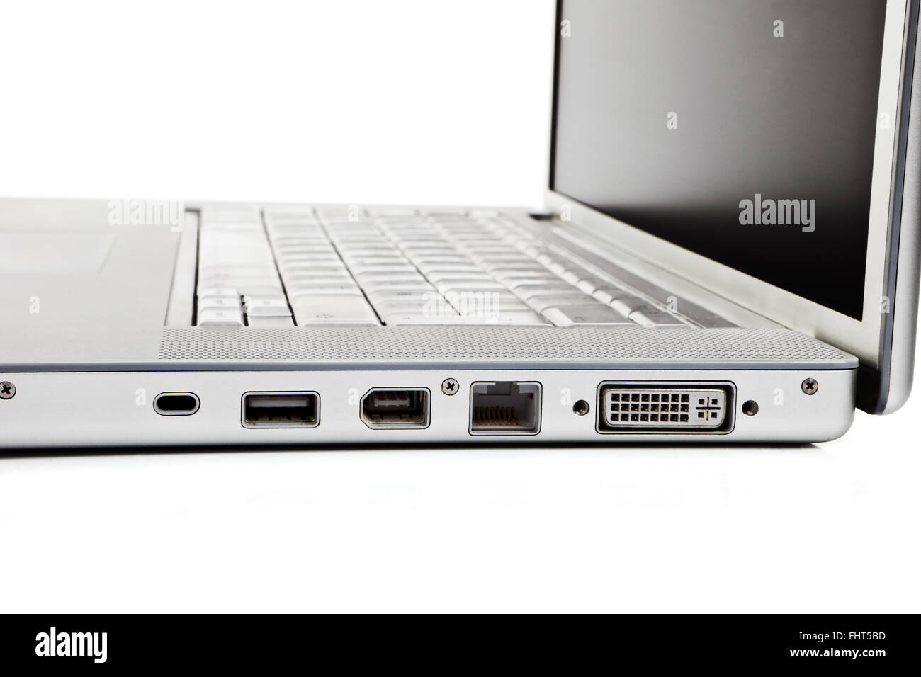 White laptop - side view. Plugs Stock Photo - Alamy