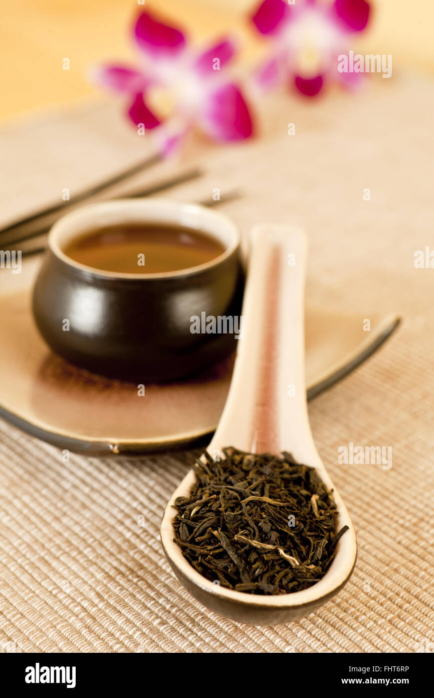 Tea leaves on a tea spoon Stock Photo - Alamy