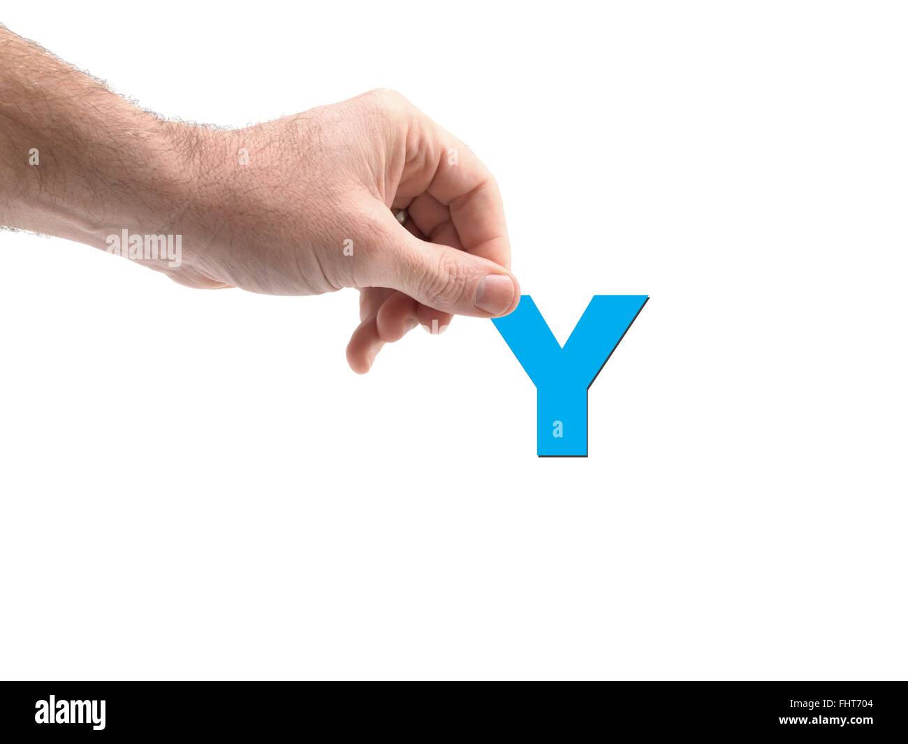 Letters of the alphabet held by a hand Stock Photo - Alamy
