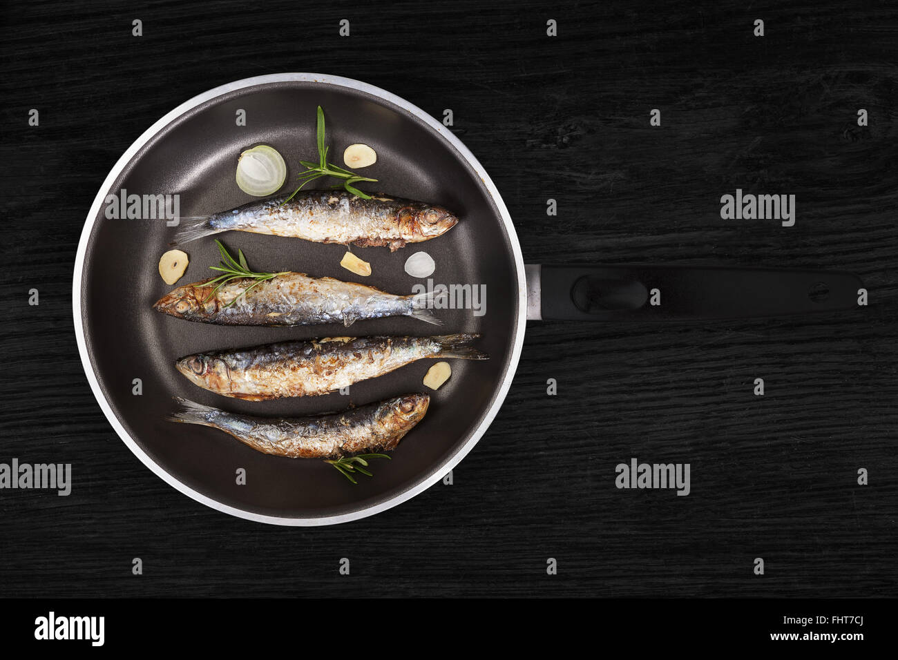 Grilled anchovy fish on pan Stock Photo - Alamy