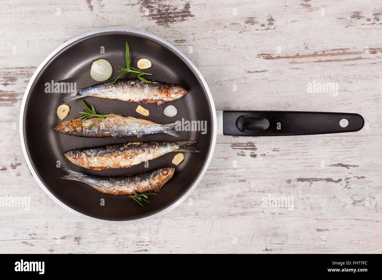 Grilled anchovy fish on pan Stock Photo - Alamy