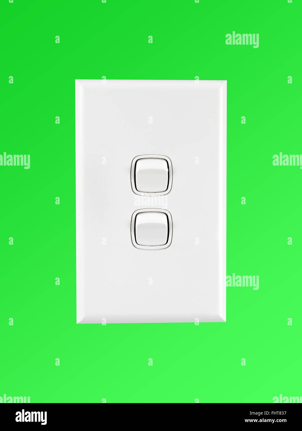 A white double light switch turned on Stock Photo - Alamy