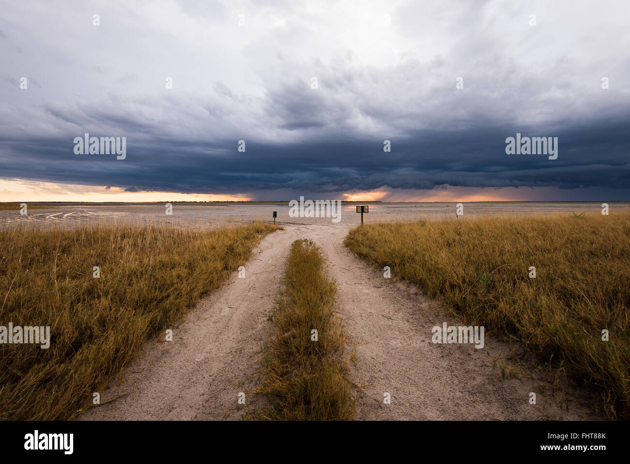 Dirt road leads into salt pans at Nxai Pans as storm approaches in ...