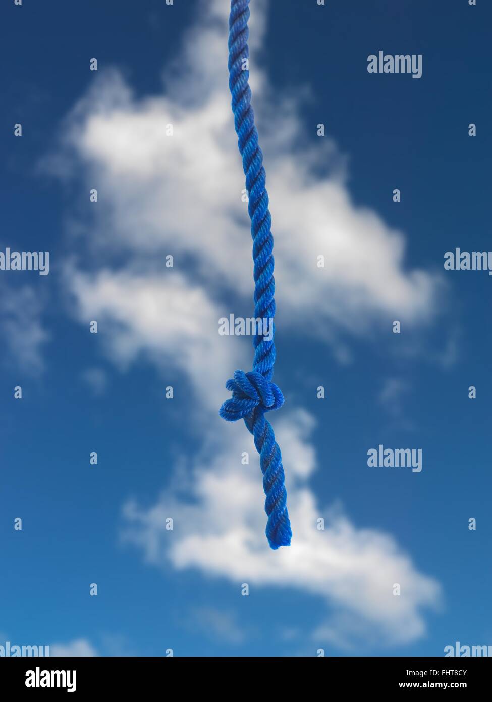 Pieces of rope isolated against a blue sky Stock Photo - Alamy