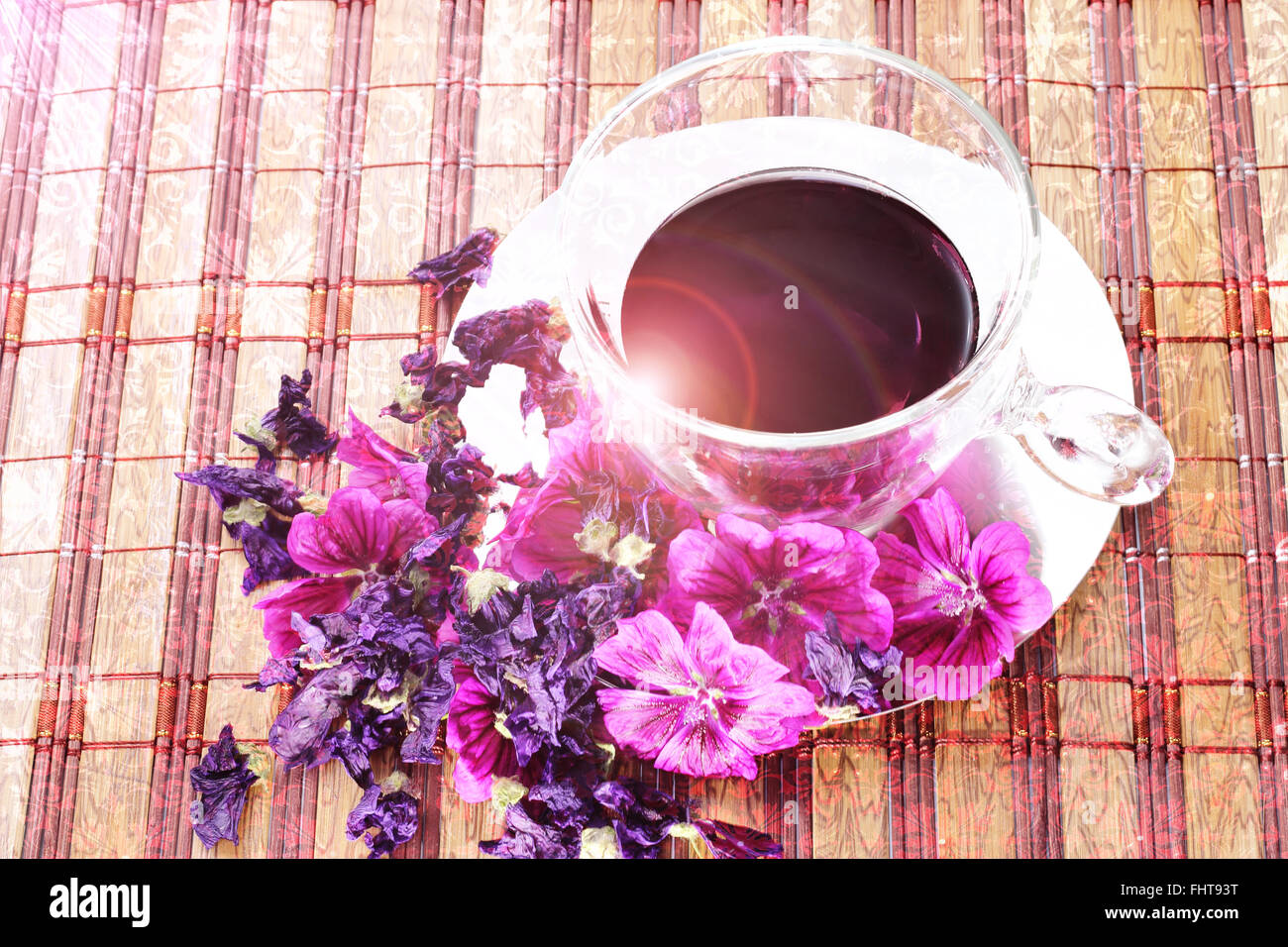 Cup with infusion of mauve flowers Stock Photo - Alamy