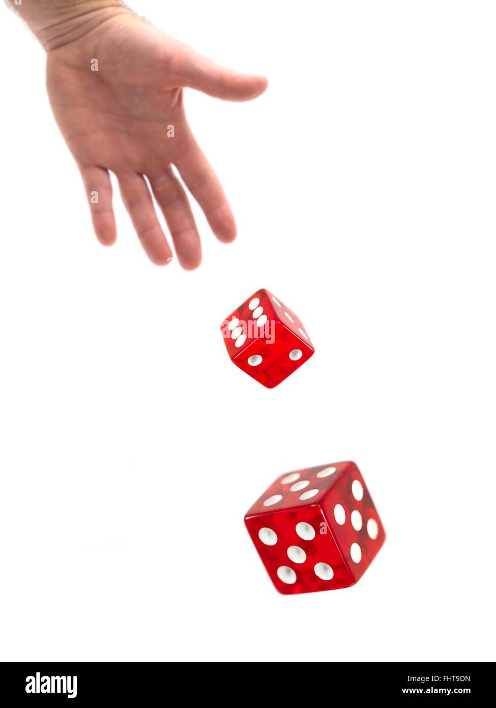 Red die isolated against a white background Stock Photo - Alamy