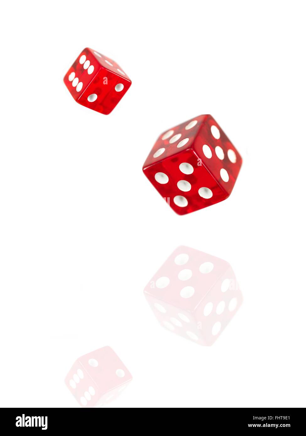 Red die isolated against a white background Stock Photo - Alamy